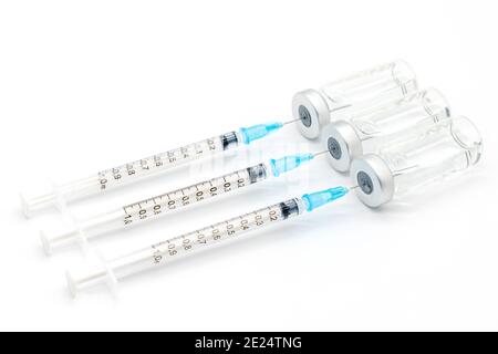 Insulin vial and uncapped syringe on white background with copy space ...
