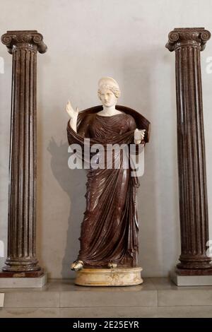 Praying Woman between Two Ionic Columns. A woman in a draped dress ...