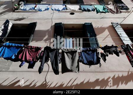 Typical view the streets of Venice washed clothes drying on cords ...
