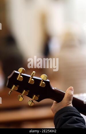 Catholic mass. Guitar player Stock Photo - Alamy