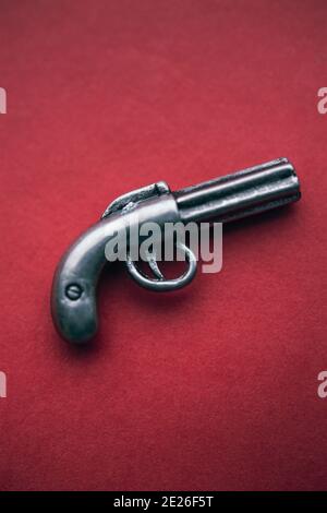 Revolver playing piece from the board game Cluedo Stock Photo - Alamy