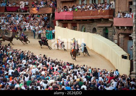 The Palio di Siena horse race on Piazza del Campo, Siena, Tuscany ...