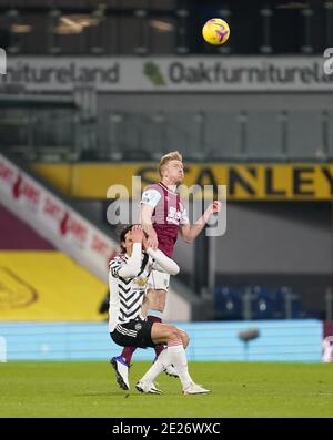 Manchester United's Edinson Cavani and Burnley's Ben Mee (right) battle ...