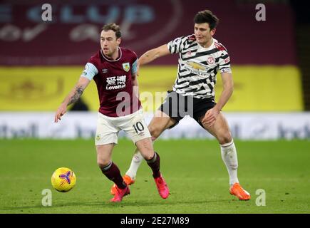 Burnley's Ashley Barnes and Manchester United's Harry Maguire battle ...