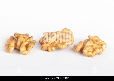 three raw walnuts in a line Stock Photo - Alamy
