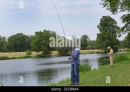 Two male friends fishing together. big game fishing. relax on nature ...