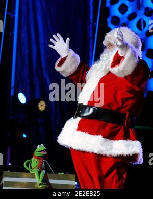 Kermit the Frog and Santa Claus perform during the 2011 National ...