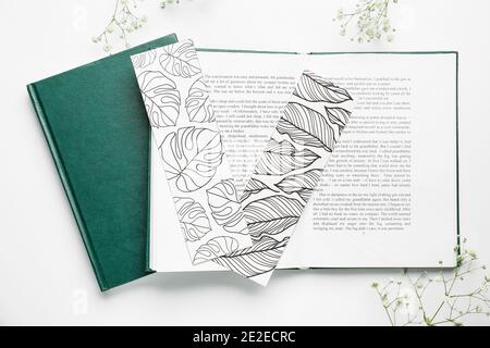 Cute bookmarks with books on white background Stock Photo - Alamy