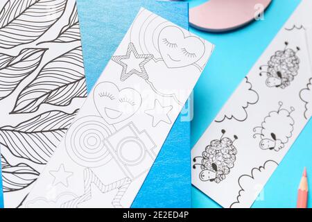 Book with cute bookmarks on color background Stock Photo - Alamy