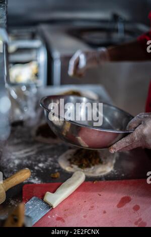 Chef preparing cooking and serving indian cuisine style dish Stock ...