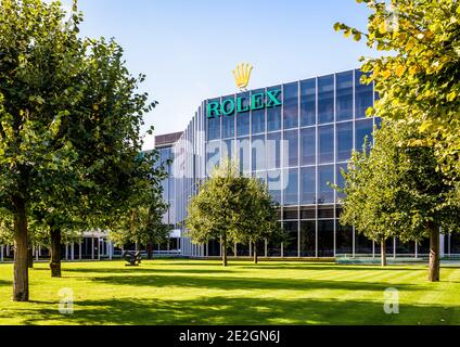Glass facade of the headquarters of Rolex, the swiss brand of luxury ...