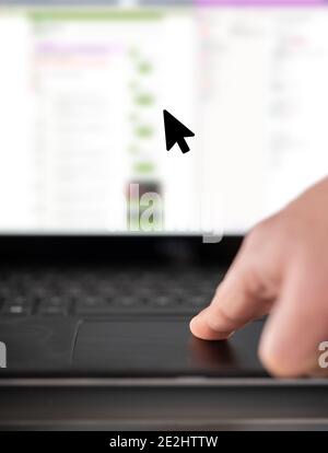 Finger moving mouse pointer on laptop touchpad, profile view Stock ...