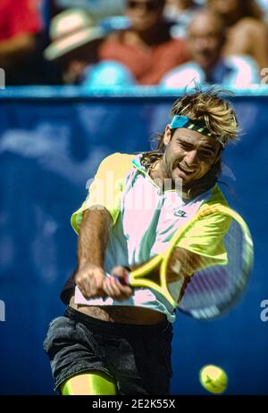 Andre Agassi (USA) competing at the 1990 US Open Tennis Championships ...