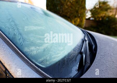 Iced-up car windscreen. The ice formed overnight as temperatures ...
