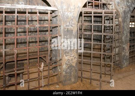 Antique prison cell with bars and bunks Stock Photo - Alamy