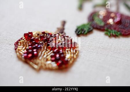 Couture embroidery of pomegranate. Still life with fruits Stock Photo ...