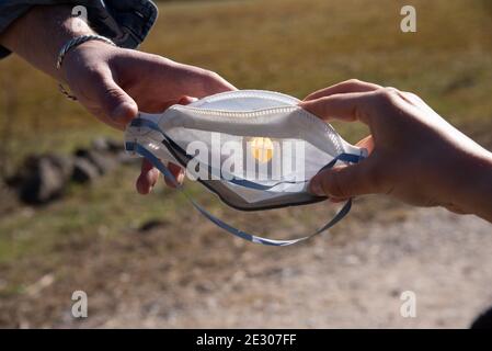 A selective focus shot of face mask on a statue - concept of the new ...