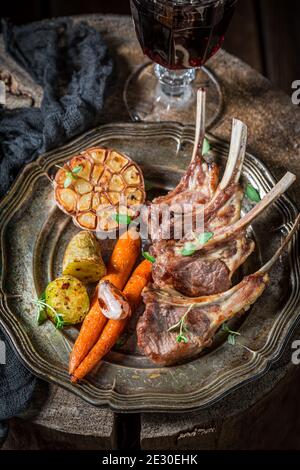 Mutton chops served with grilled vegetables Stock Photo - Alamy