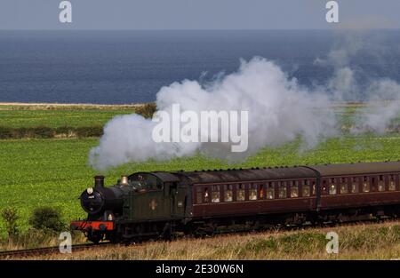 G.W.R. Class 56XX No. 5619 steam locomotive passing Weybourne windmill ...