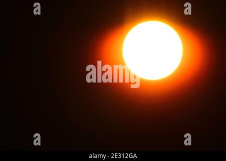 very brightly shining sun with radiation and dark sky closeup Stock ...