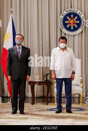 Philippine President Rodrigo R. Duterte smiles as he views two custom ...