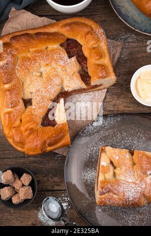 side view golden sweet rolls on a blue wood background Stock Photo - Alamy
