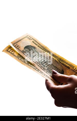 Man hand giving money like a bribe or tips. Holding EURO banknotes on a ...