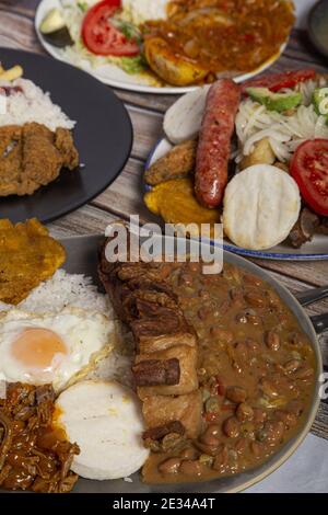 Variety of typical dishes of Colombian gastronomy. Picada, tripe, San ...