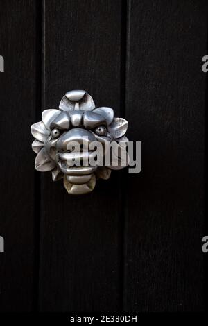 Snarling dragon with large nose as a door knob or handle Stock Photo ...