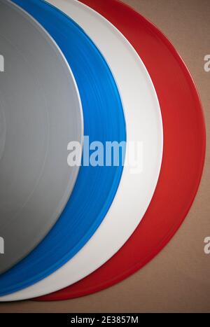 A collection of different coloured vinyl records Stock Photo - Alamy