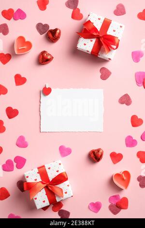 Composition with blank card, gifts for Valentine's Day and ribbons on ...
