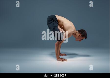 Yoga keeps balanc in a difficult pose on one leg Stock Photo - Alamy