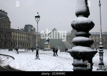 The Louvre museum under the snow in Paris, France on December 9, 2010 ...