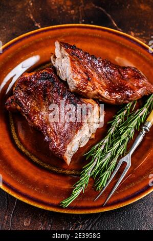 BBQ grilled veal calf brisket meat and french fries potatoes with sauce ...