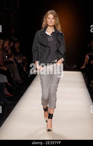 Constance Jablonski displays a creation by designer Viktor and Rolf ...