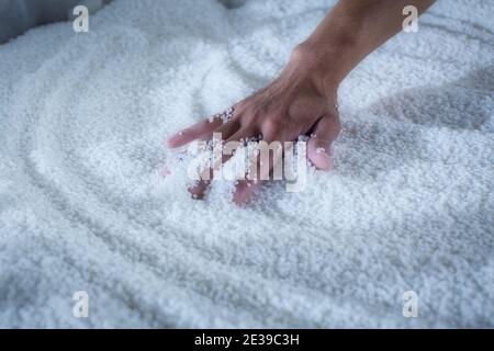Producing Japanese sake: Hands with grains of rice for the production ...