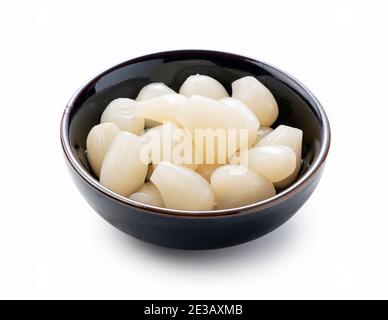 Japanese Rakkyo in a black bowl placed on a white background Stock ...
