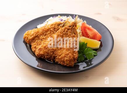 Fried horse mackerel served on a plate on a wooden background Stock ...
