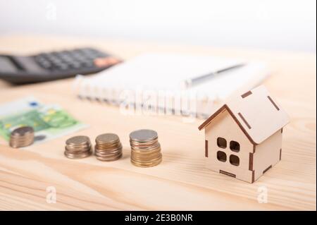 Mortgage concept Money and house risk sale tax Stock Photo - Alamy