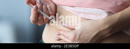 Doctor gives an injection in the stomach of a pregnant woman Stock ...