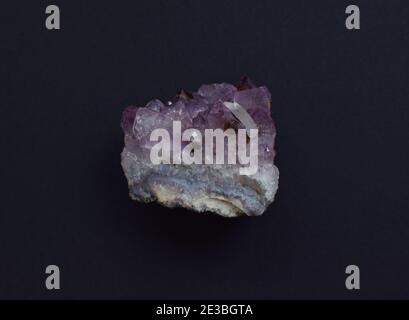 Natural amethyst on gray background Stock Photo - Alamy