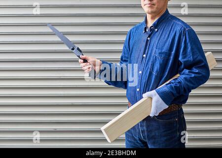 Japanese man doing DIY Stock Photo - Alamy