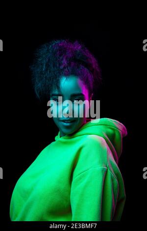 Dreamful. African-american woman's portrait on blue studio background ...