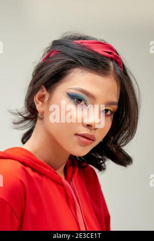 Image of surprised korean girl in dress, female model staring at camera ...