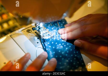 Sewing machine with girl close-up Stock Photo - Alamy