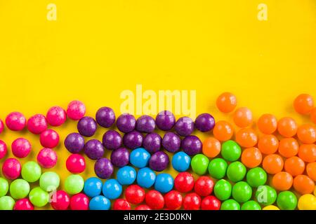 Skittles candy on the colorful table, colorful sweet candy background ...