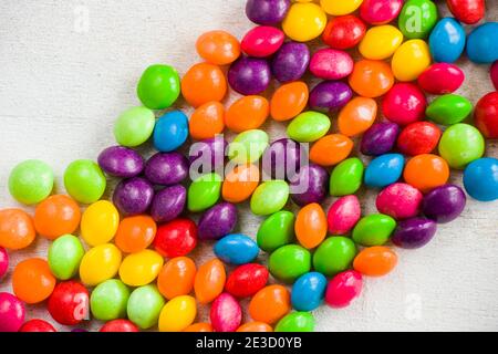 Skittles candy on the colorful table, colorful sweet candy background ...
