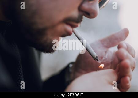 Photo of nervous bearded guy hold smartphone bite lip look camera wear ...