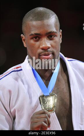 France's Teddy Riner poses with the gold medal after winning the men's ...