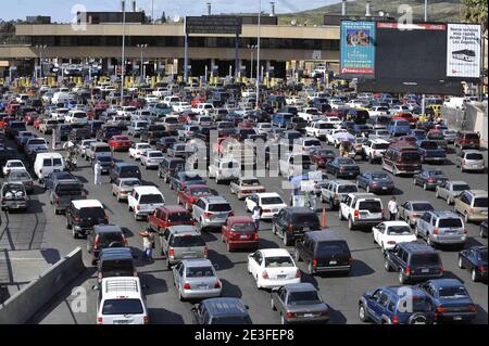 Tijuana, Mexico - As cars wait in long lines to cross the U.S.-Mexico ...